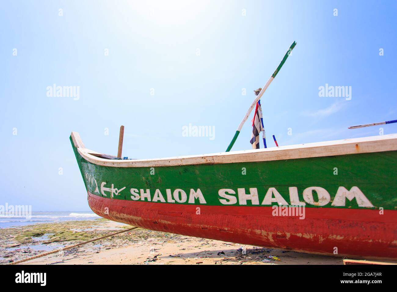 Traditional Ghanaian style wood boat on beach Stock Photo - Alamy