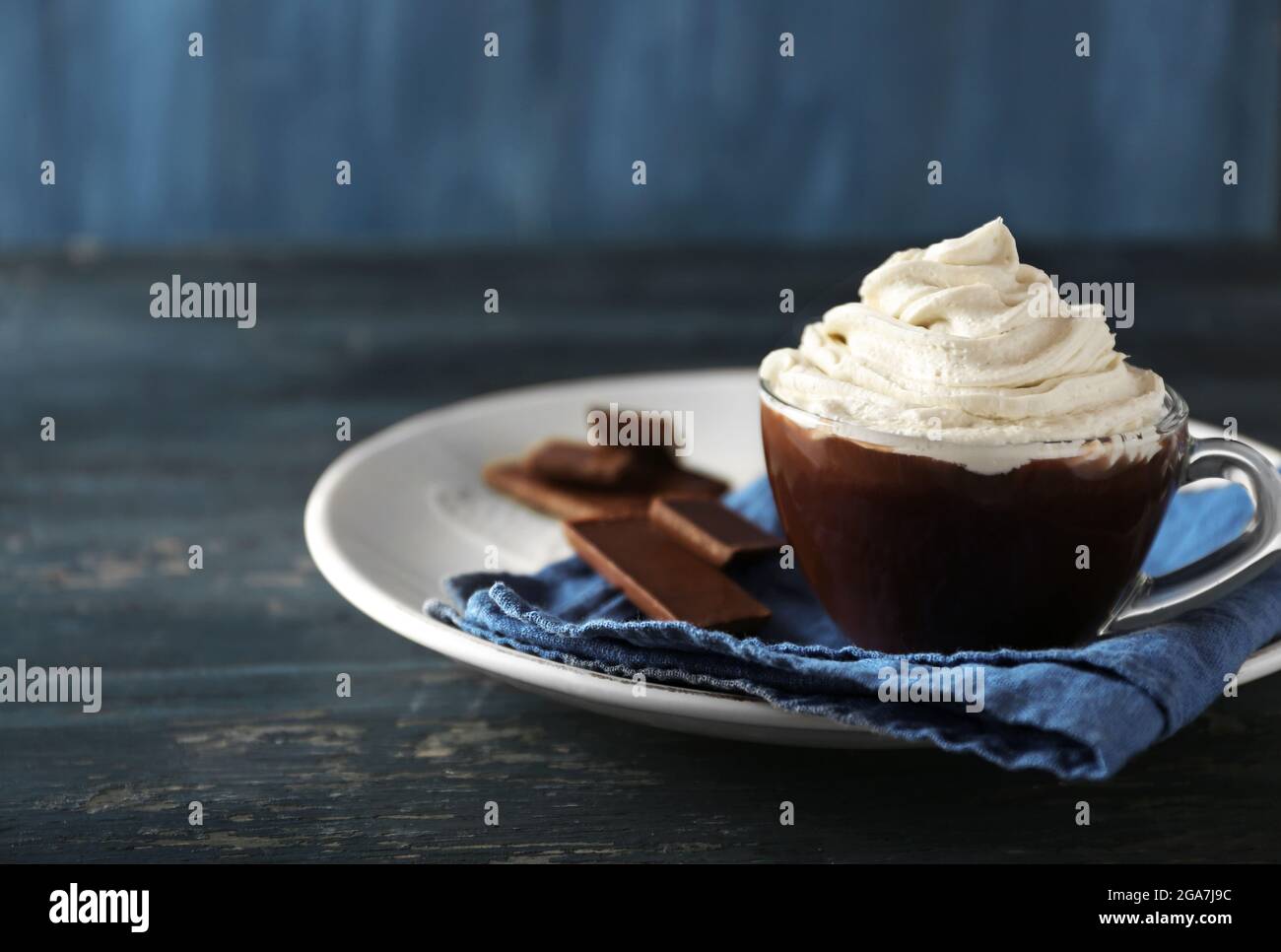 Cup of coffee with cream on color wooden background Stock Photo - Alamy