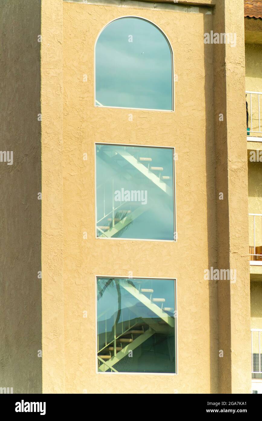 Staircase inside a building seen through its windows Stock Photo - Alamy