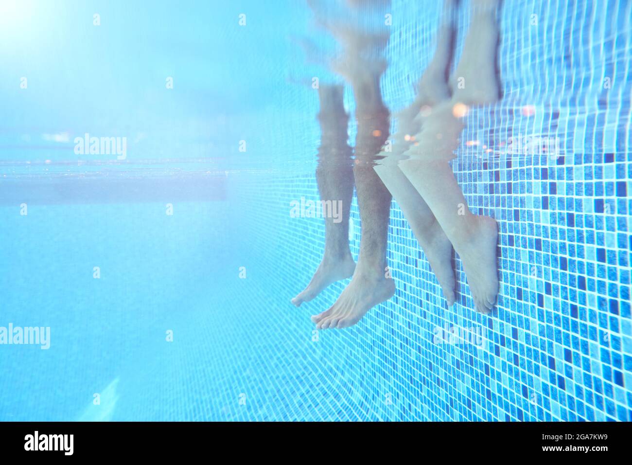 Man sitting on edge swimming hi-res stock photography and images - Alamy