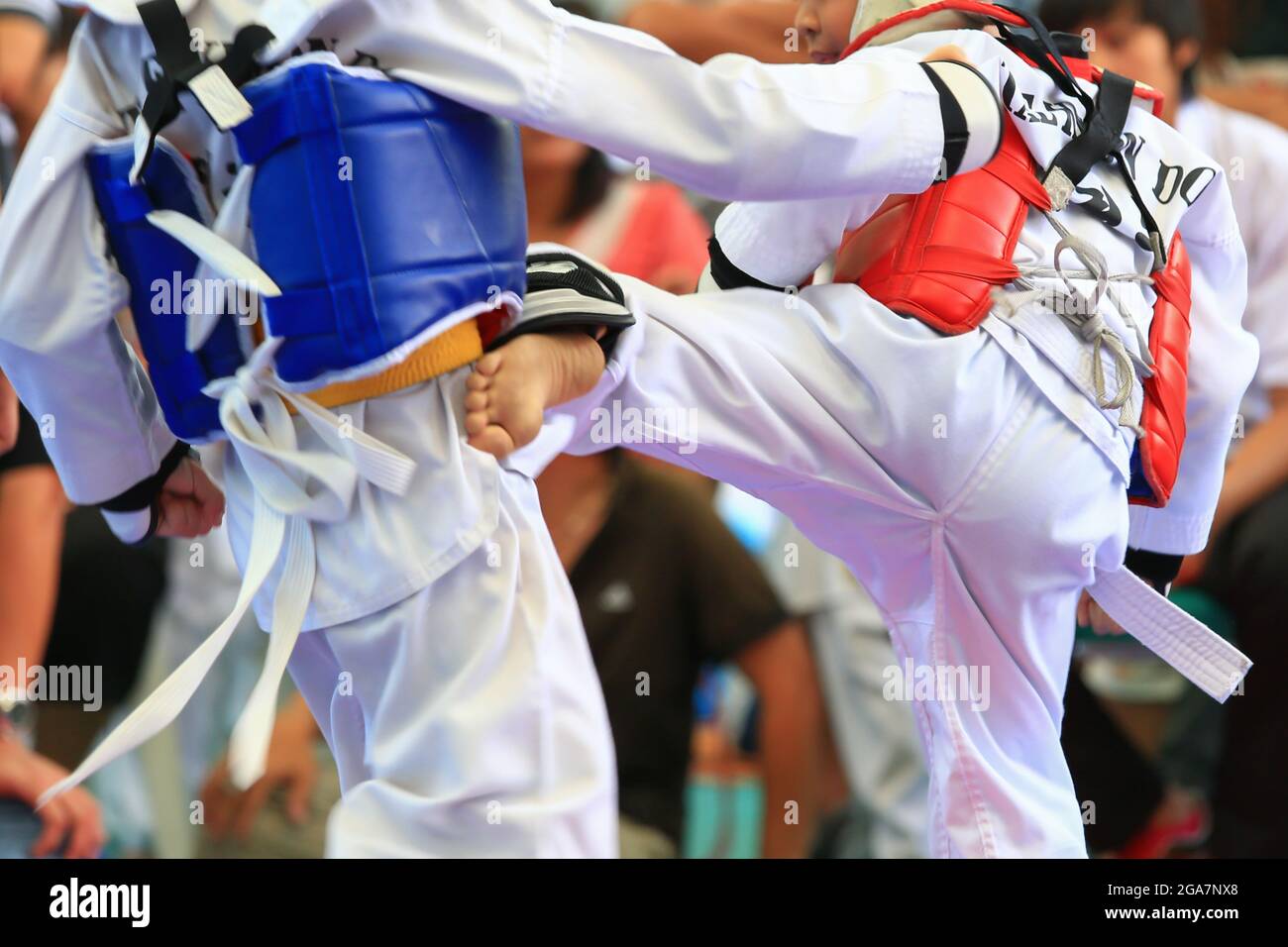 Young Taekwondo athletes are fighting during contest Stock Photo - Alamy