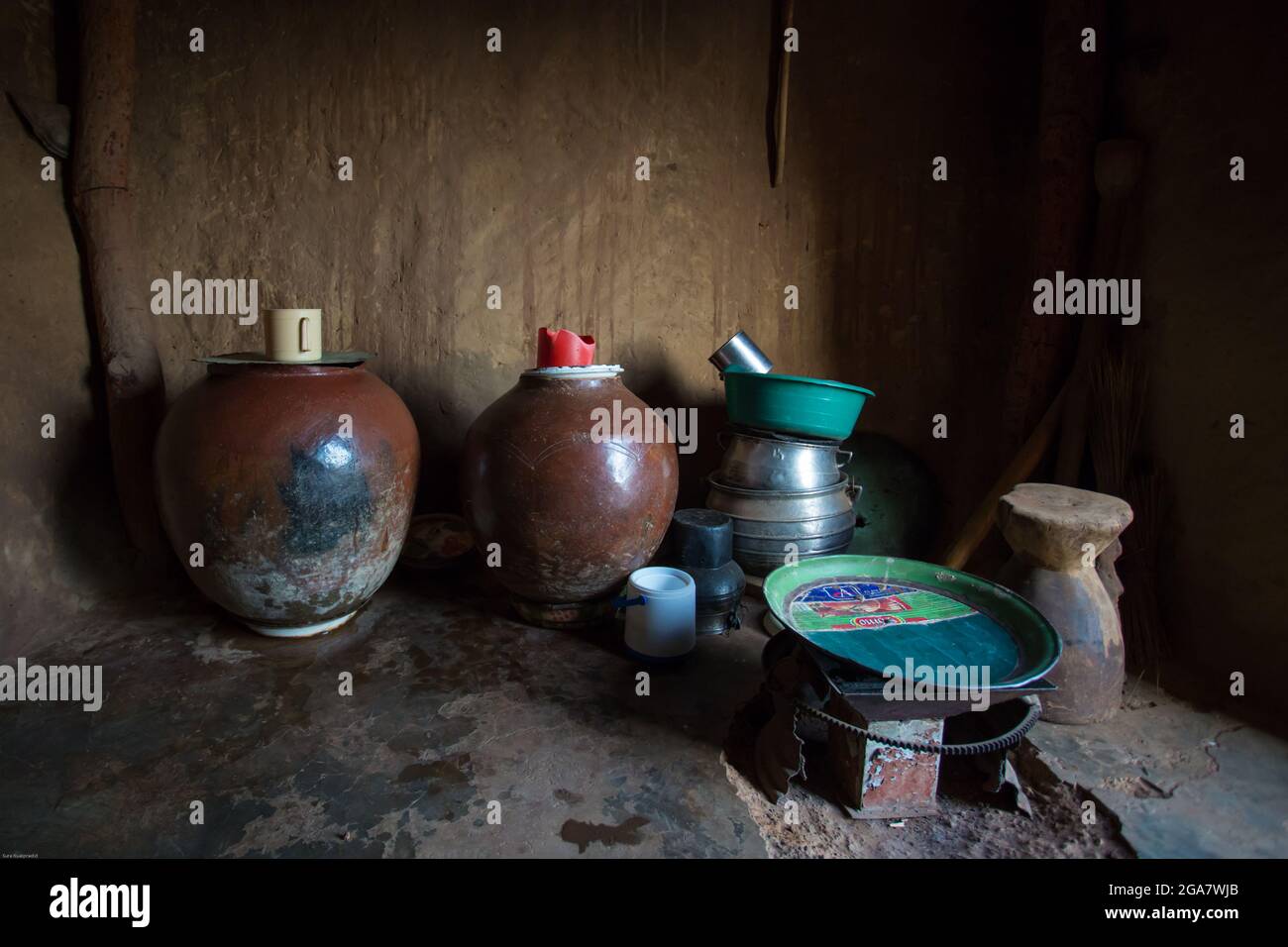 Objects use inside native african style clay house Stock Photo - Alamy