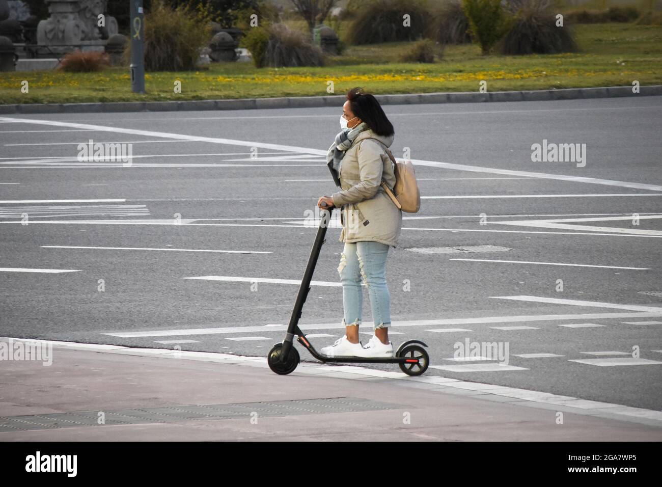 Woman riding on electric scooter Stock Photo - Alamy