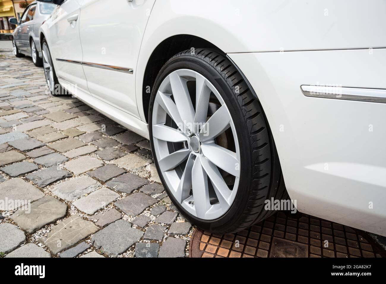 Modern car wheel with a light alloy disc. Low chassis Stock Photo - Alamy