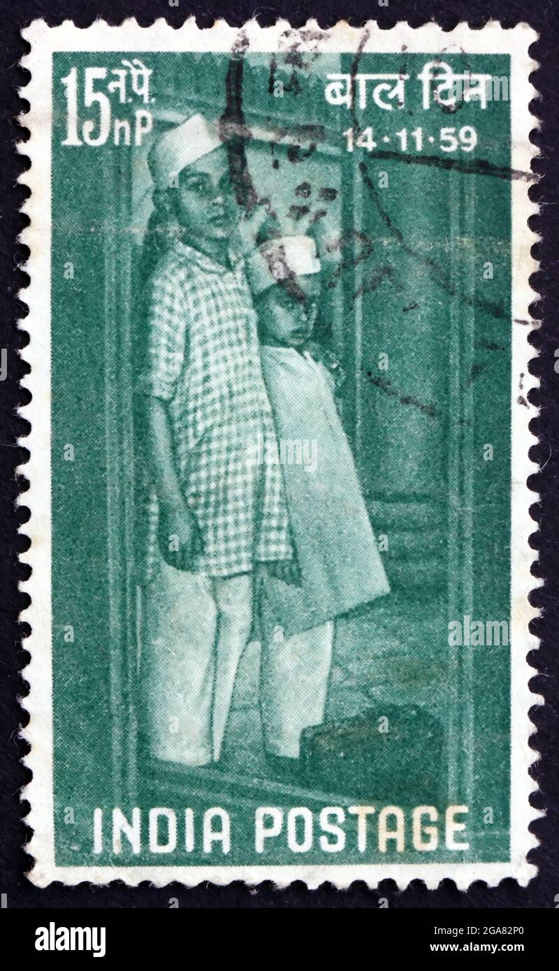 INDIA - CIRCA 1959: a stamp printed in India shows Children Arriving at ...