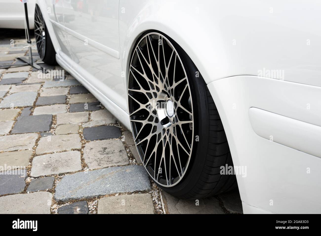 Modern car wheel with a light alloy disc. Low chassis Stock Photo - Alamy