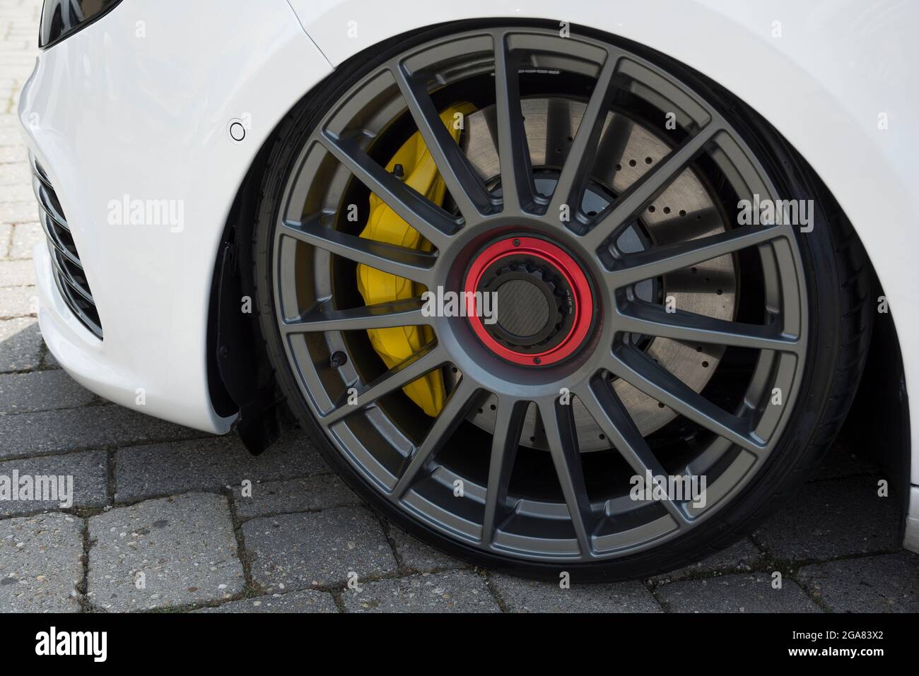 Modern car wheel with a light alloy disc. Low chassis Stock Photo - Alamy