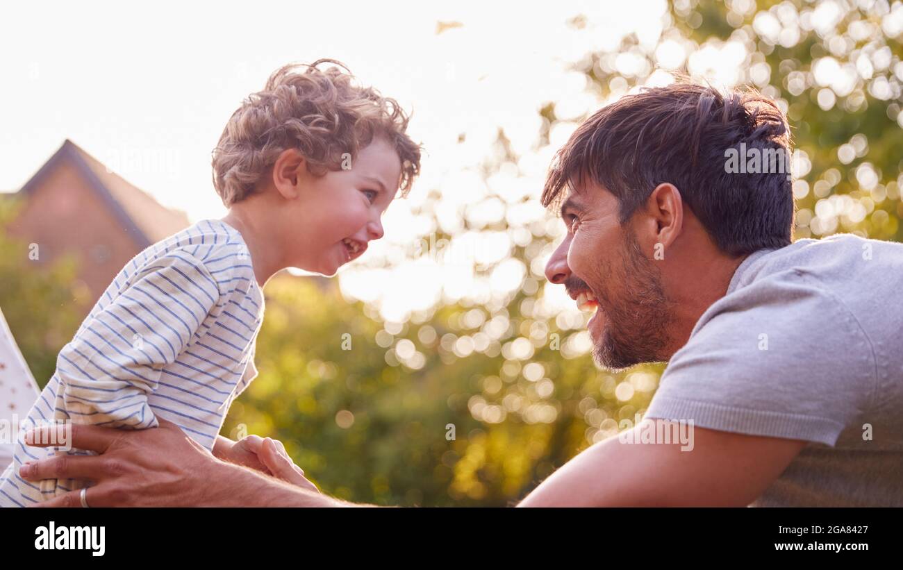 Loving Father With Son Having Fun In Garden At Home Together Stock ...