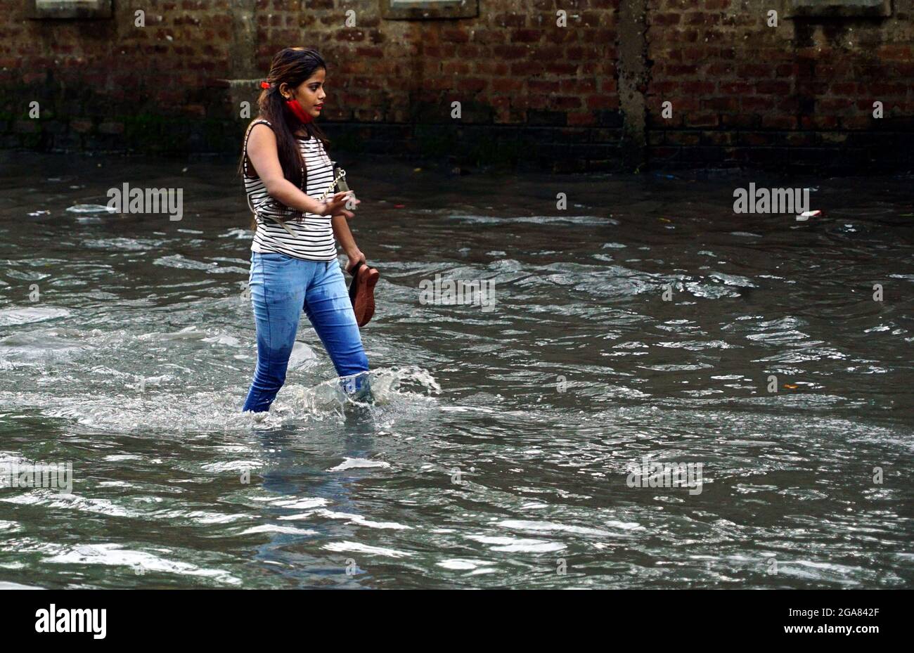 Guwahati, India's northeastern state of Assam. 29th July, 2021. A woman ...