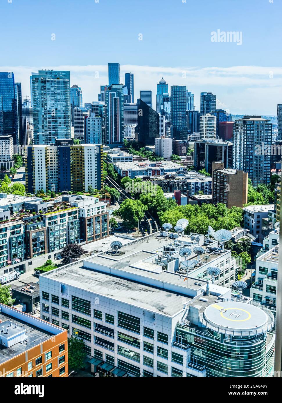 Tall buildings in downtown Seattle, Washington with Mount Rainier in ...