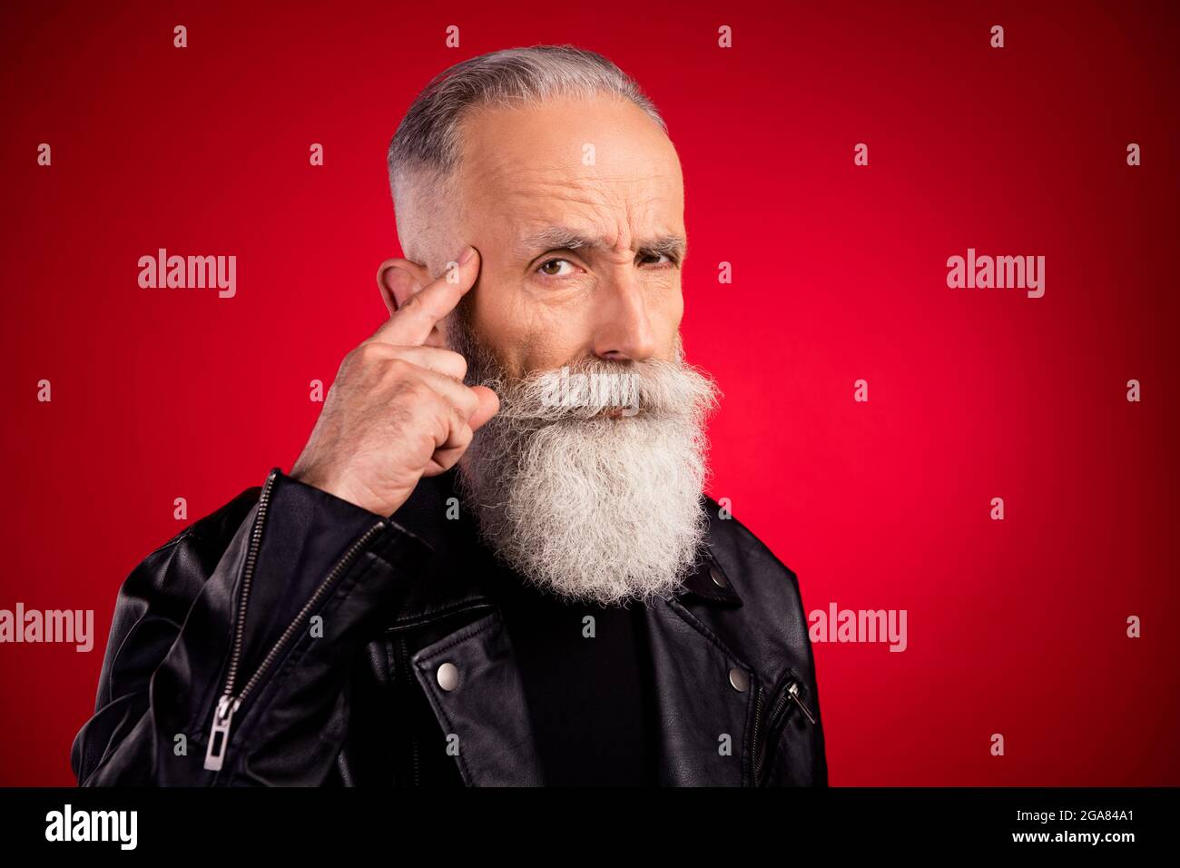 Portrait of attractive skeptic bewildered grey-haired man touching ...