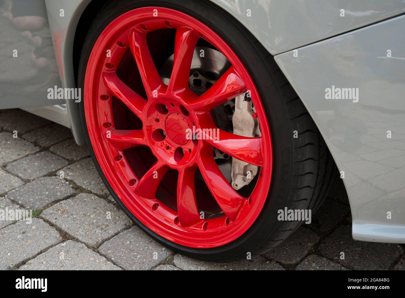 Modern car wheel with a light alloy disc. Low chassis Stock Photo - Alamy