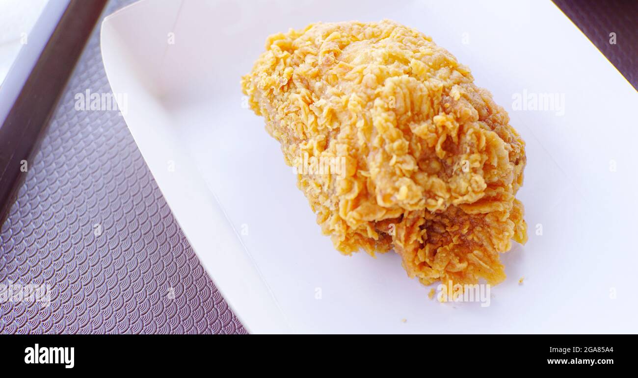 Delicious crispy chicken with crumbs on a paper plate Stock Photo - Alamy