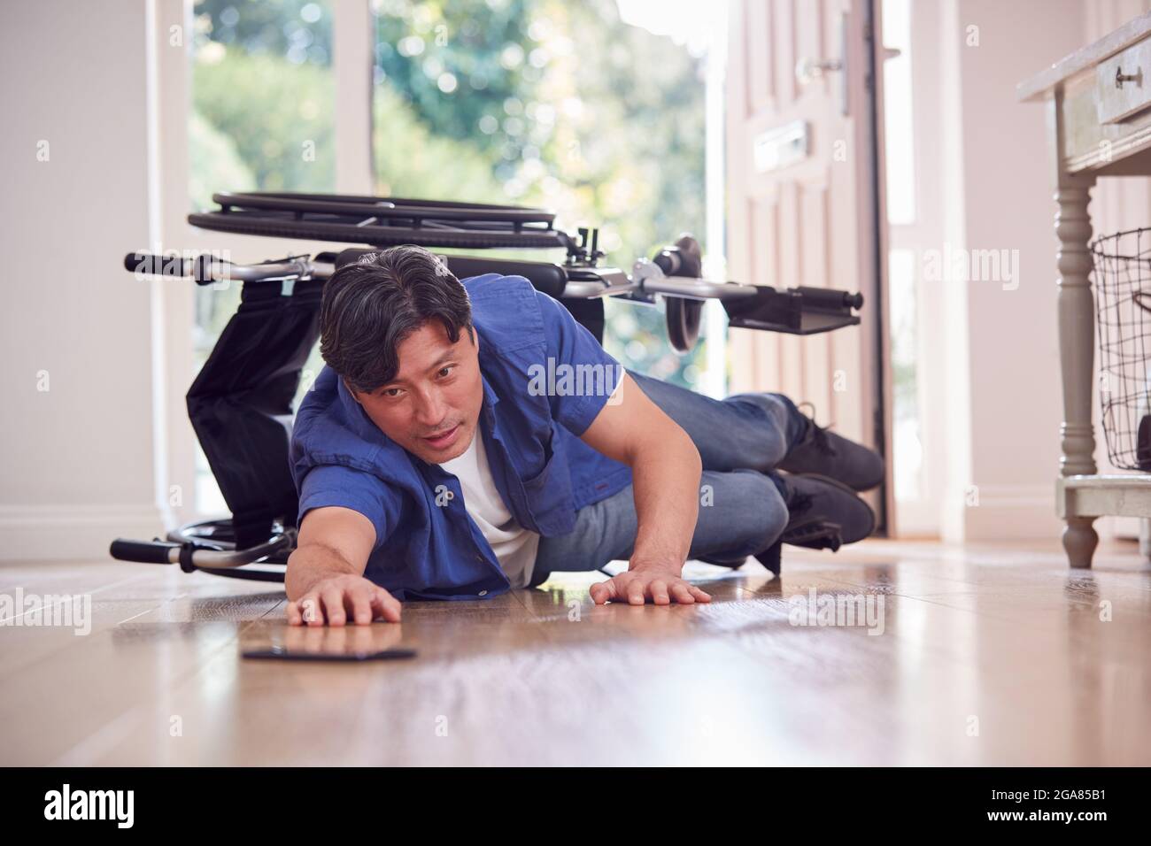 Fall falling wheelchair disabled hi-res stock photography and images ...