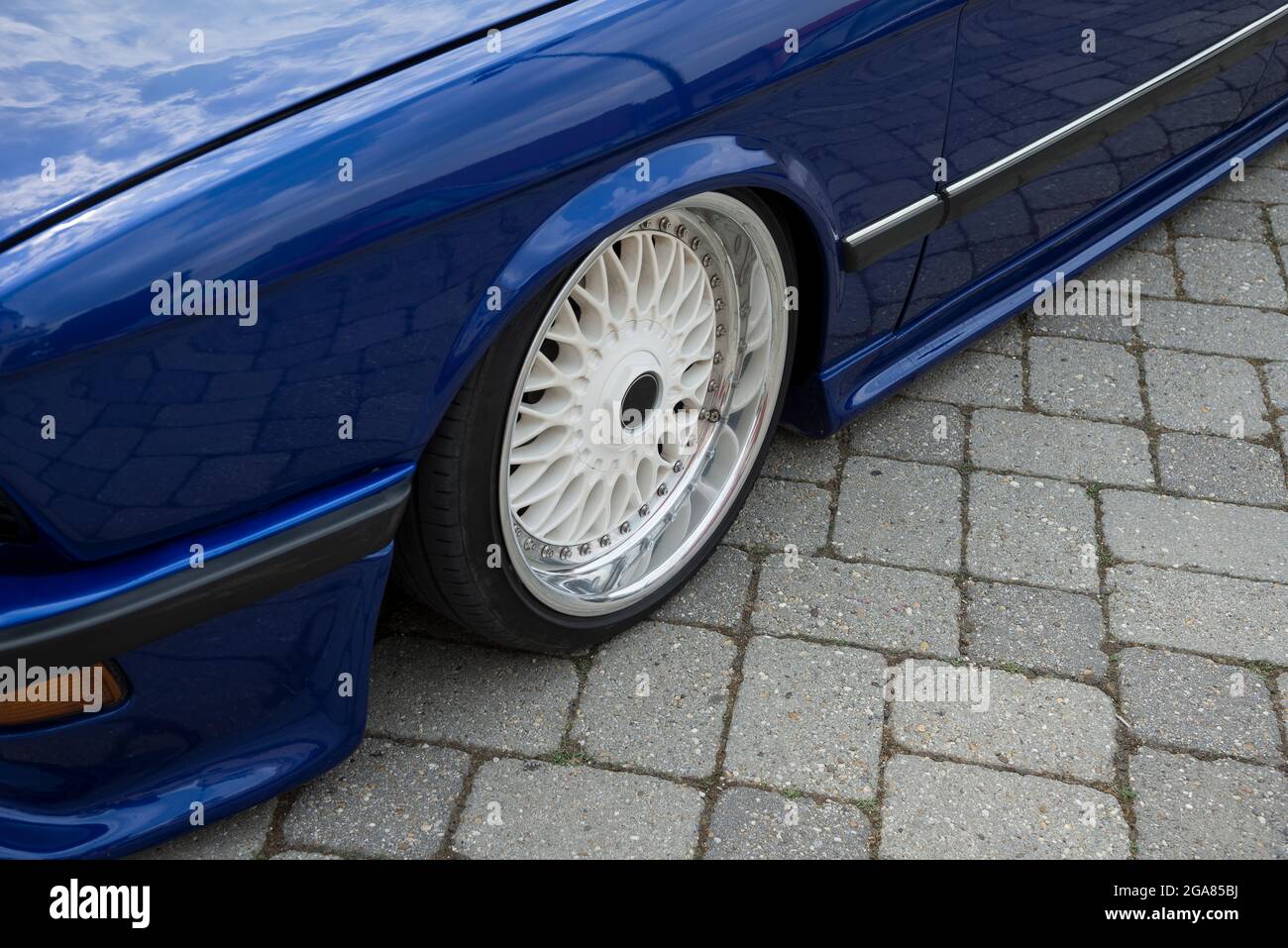 Modern car wheel with a light alloy disc. Low chassis Stock Photo - Alamy