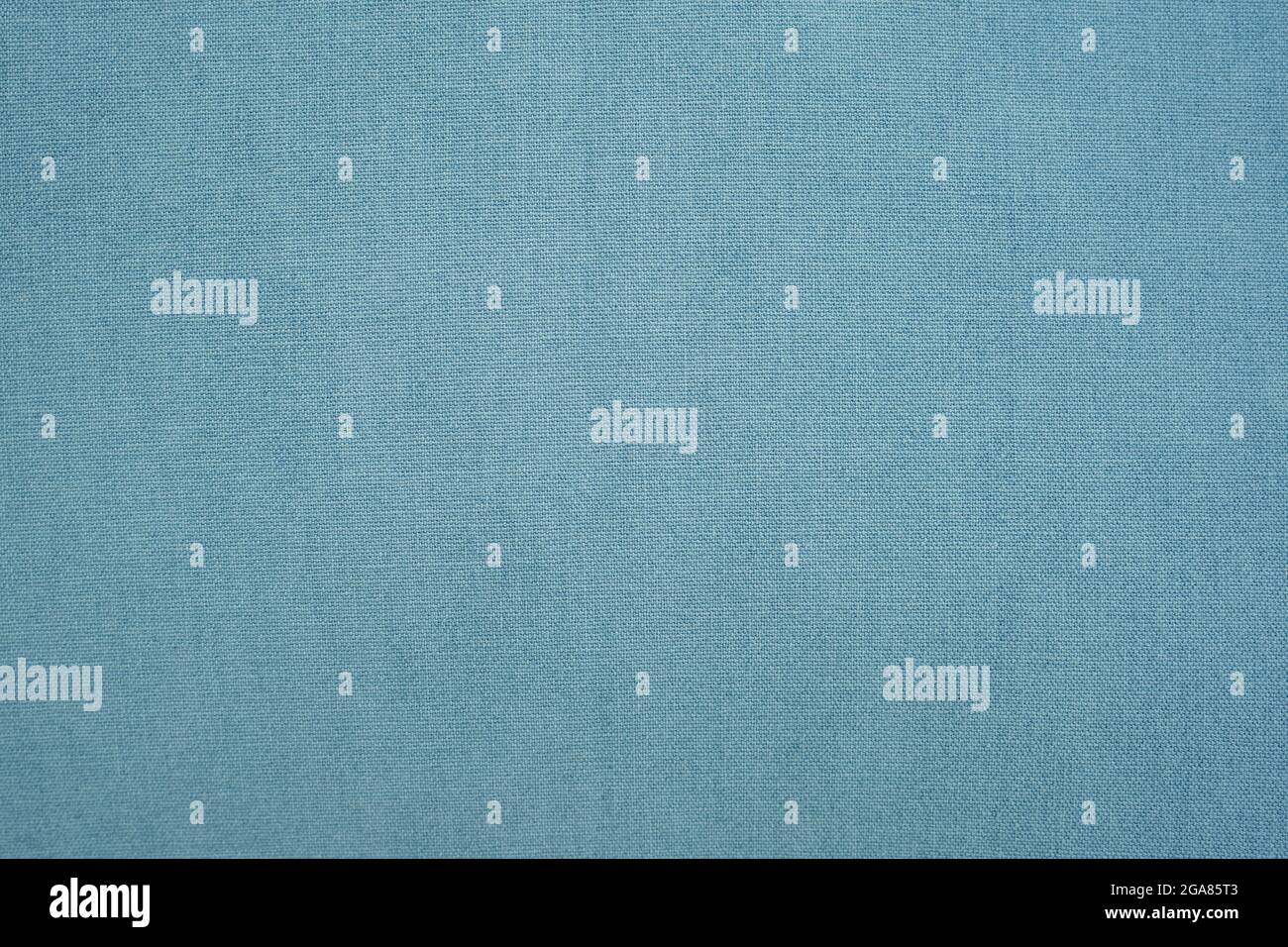 Closeup shot of a blue fabric wall used for wallpaper or background ...