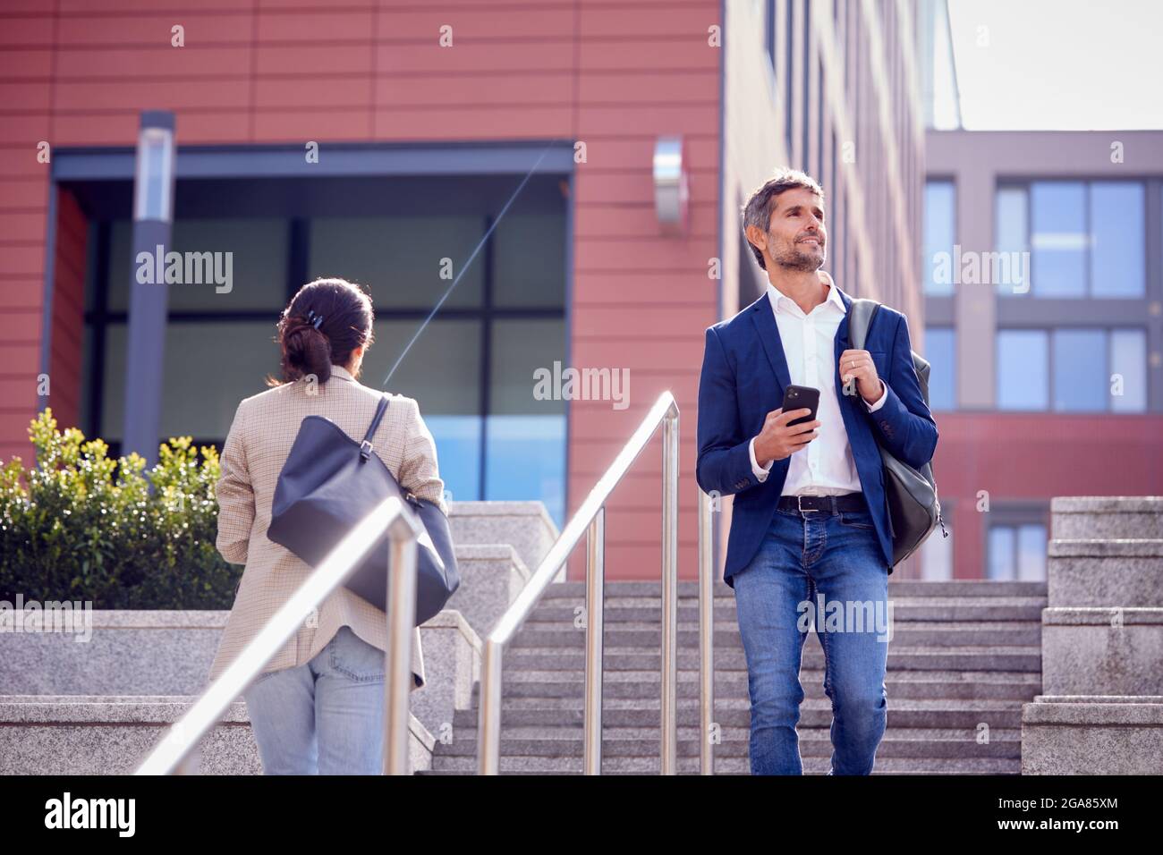 Women passing stairs hi-res stock photography and images - Alamy