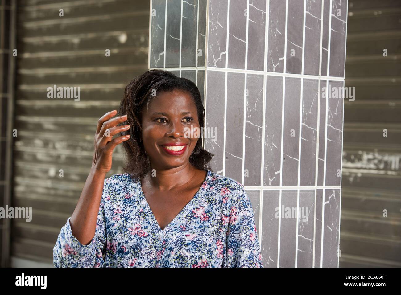 young smiling woman standing outside. Portrait of a serious woman with ...