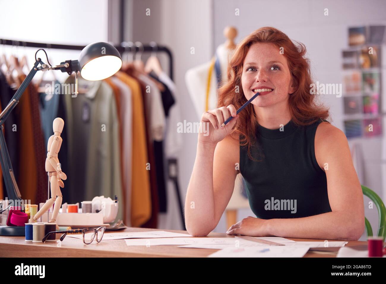 Thoughtful Female Student Or Business Owner Working In Fashion ...