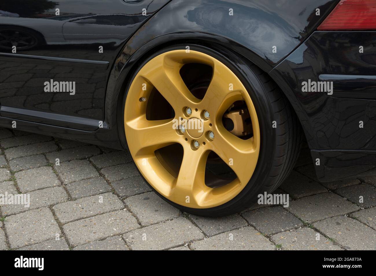 Modern car wheel with a light alloy disc. Low chassis Stock Photo - Alamy