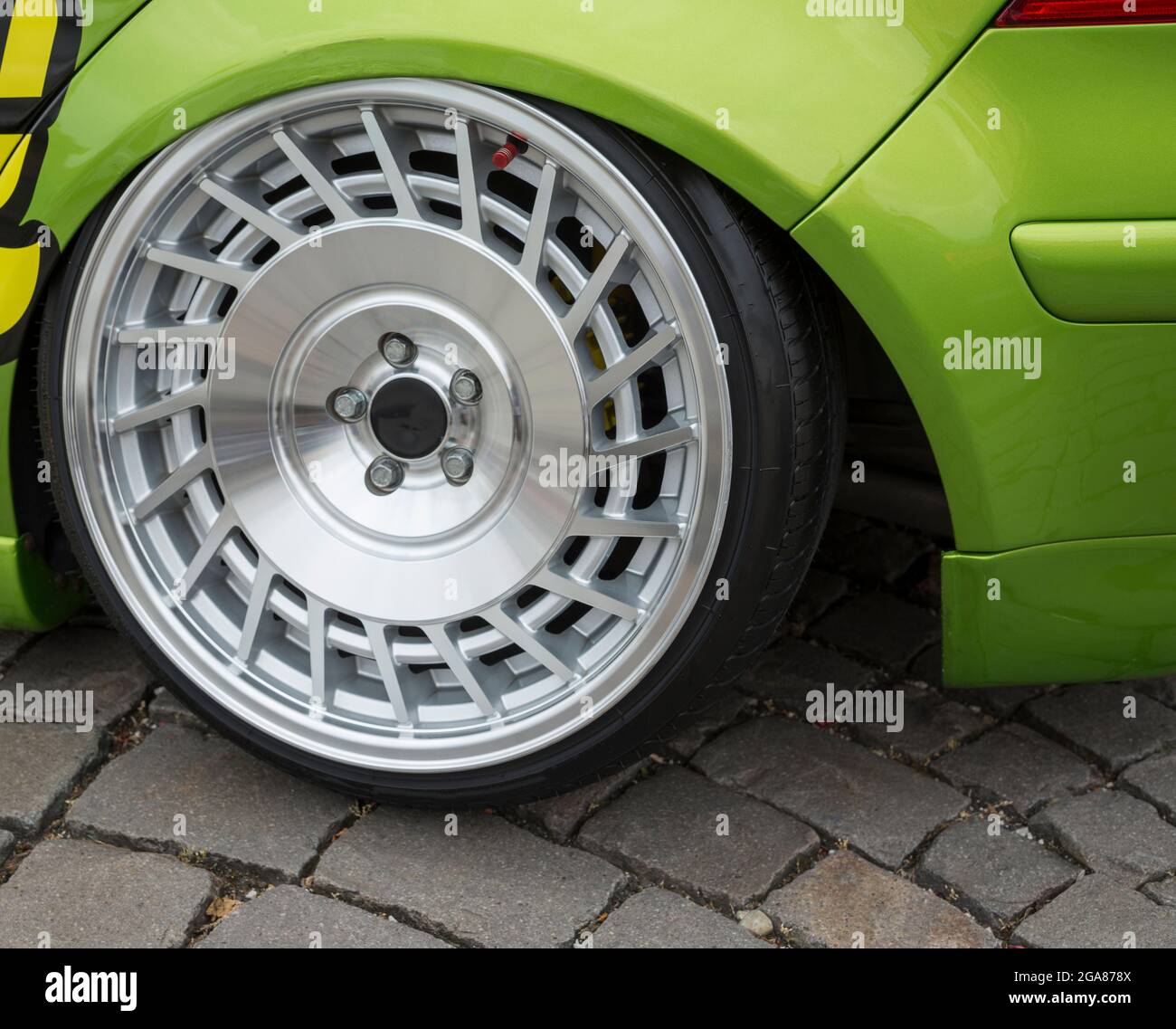 Modern car wheel with a light alloy disc. Low chassis Stock Photo - Alamy