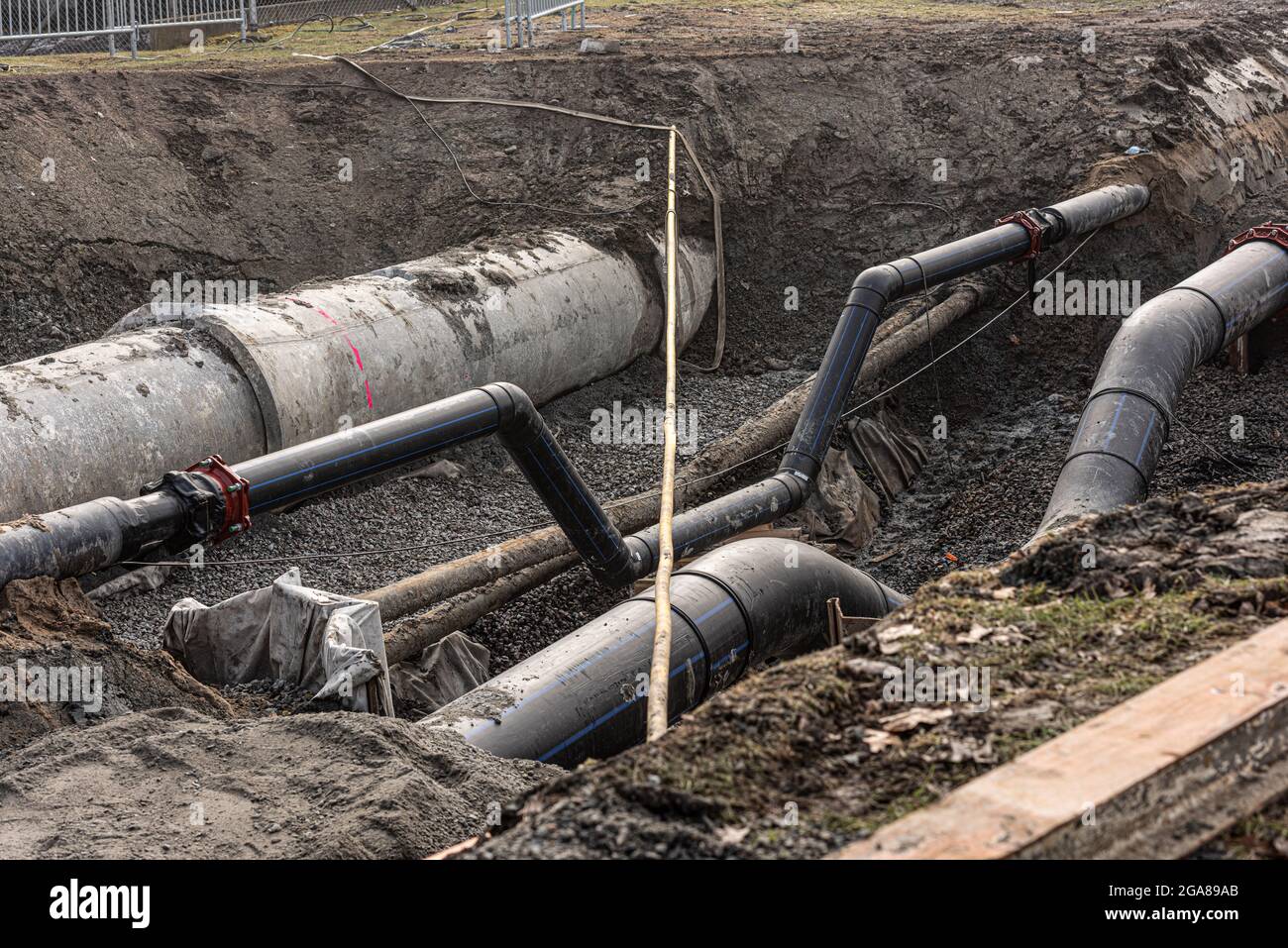 Sewage and water pipes being prepared for a new crossing pipe Stock ...