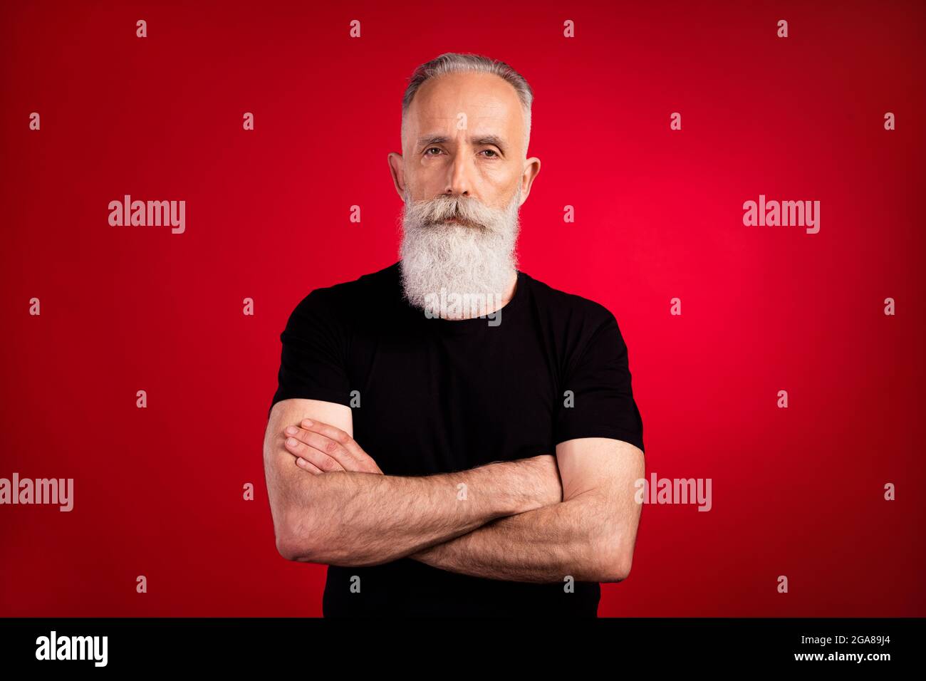 Portrait of attractive serious content fit strong grey-haired man ...