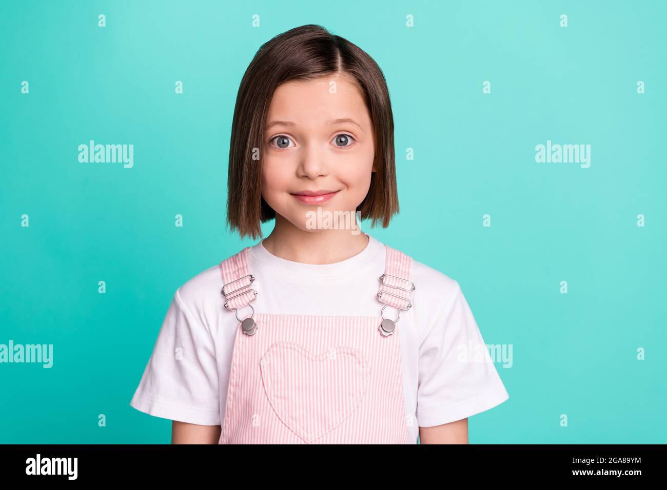 Photo of happy nice little girl smile good mood wear pink overall cute ...