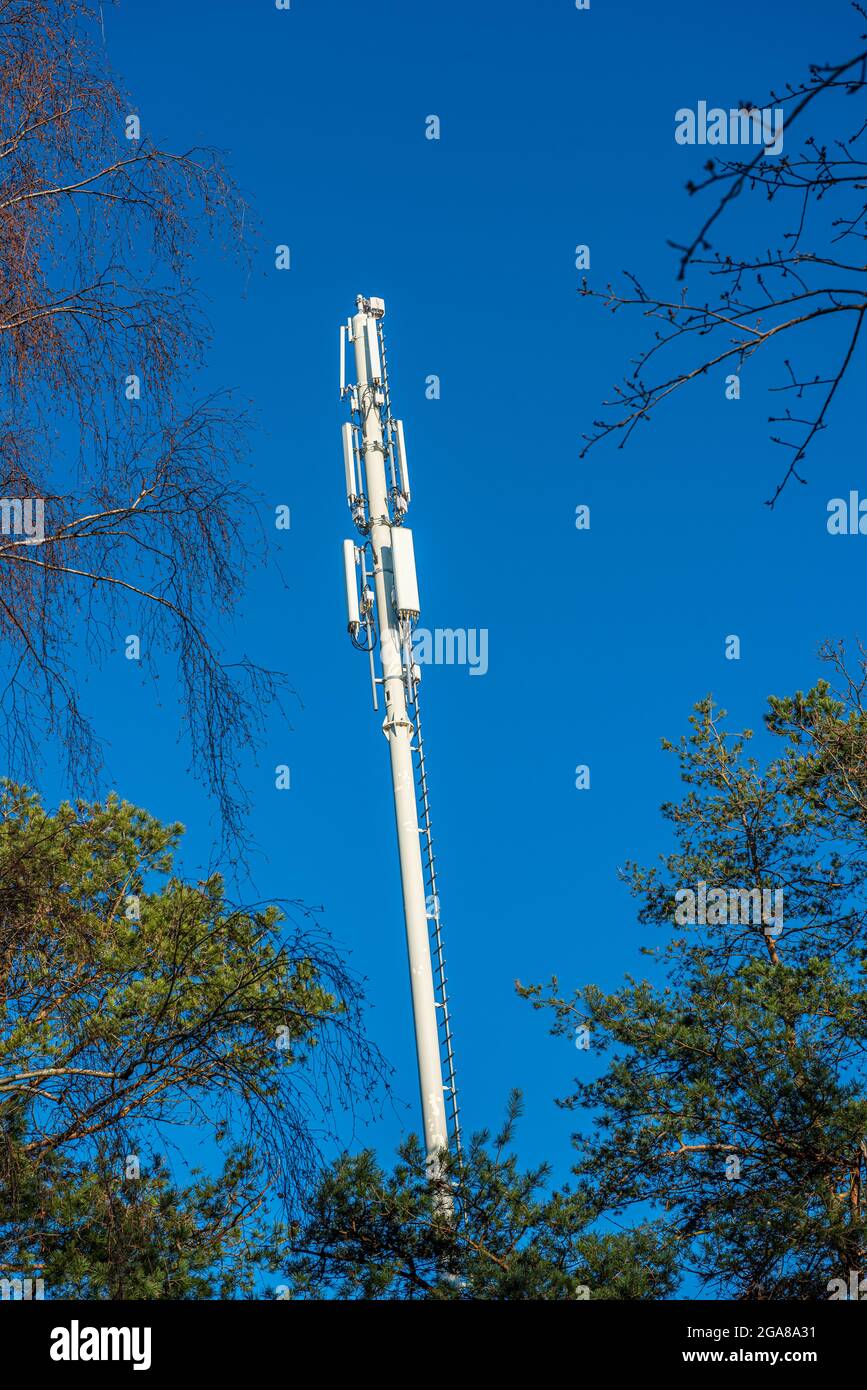 Mobile communications antenna tower in a forest Stock Photo - Alamy
