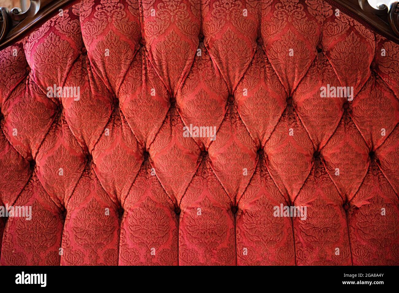 Seating back texture of a red rococco inspired sofa Stock Photo - Alamy