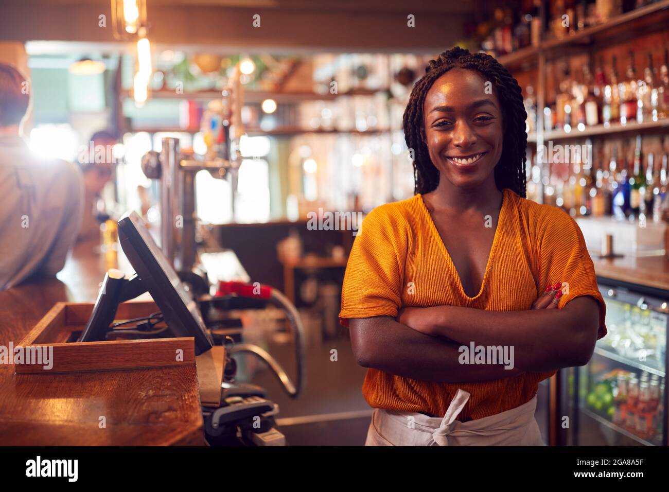 Portrait Of Smiling Female Bar Owner Standing Behind Counter Stock ...