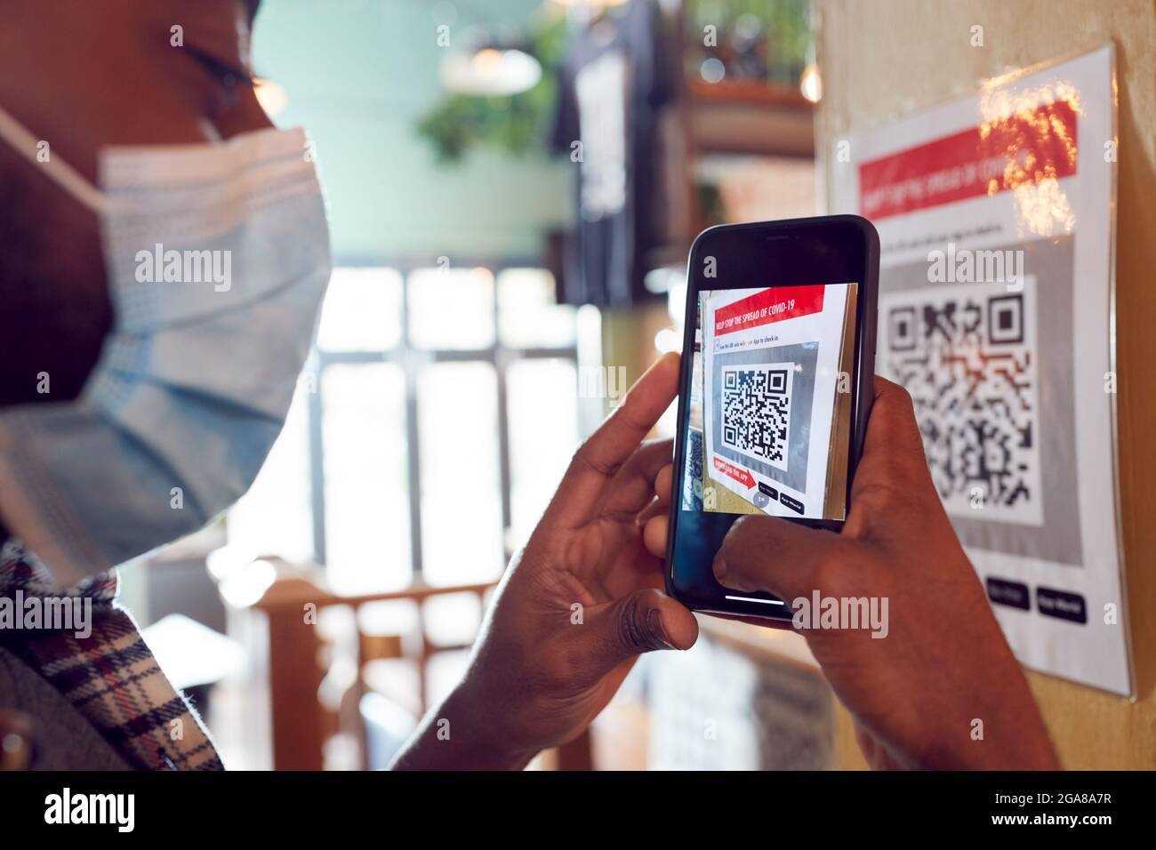 Man In Mask With Mobile Phone Checking Into Venue Scanning QR Code ...