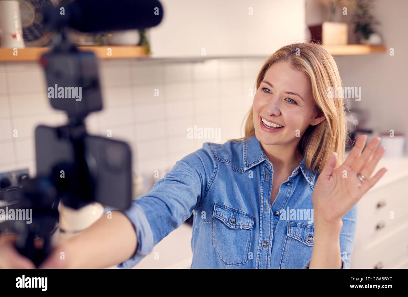 Female Vlogger Holding Mobile Phone Camera Making Social Media Video At ...