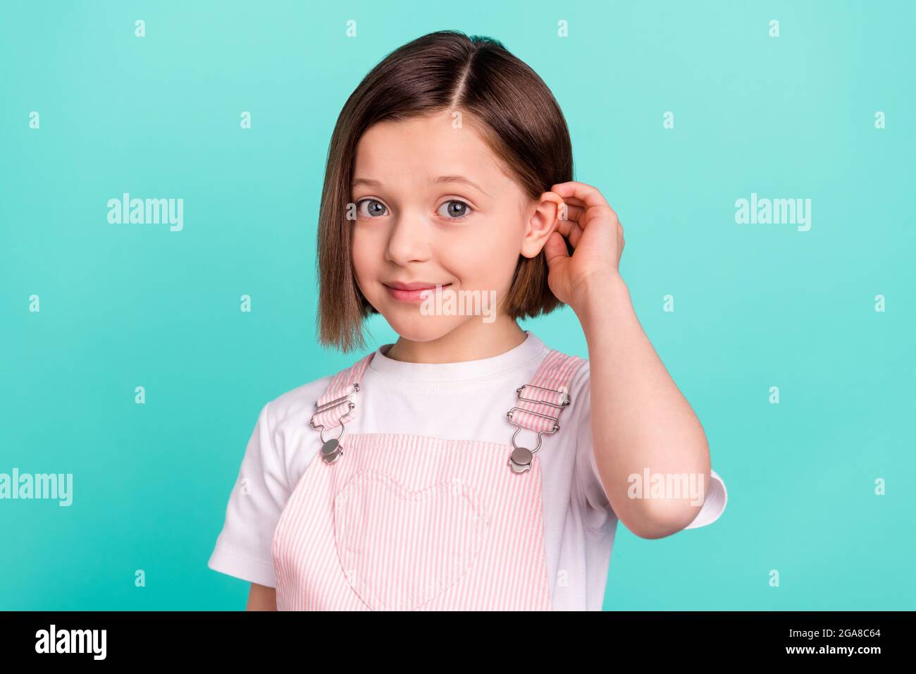 Photo of cheerful cute nice young little girl touch hair good mood ...
