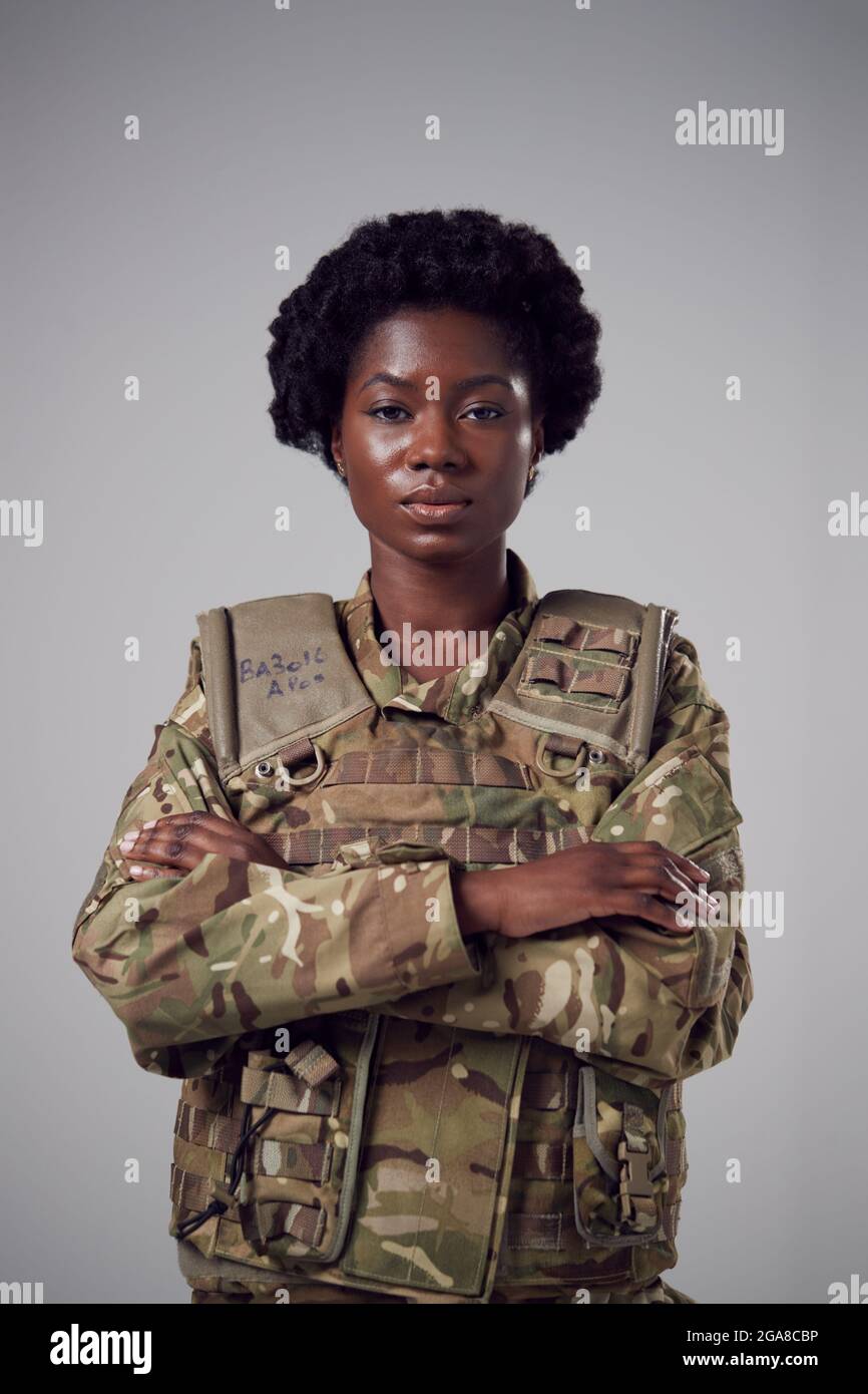 Studio Portrait Of Serious Young Female Soldier In Military Uniform ...