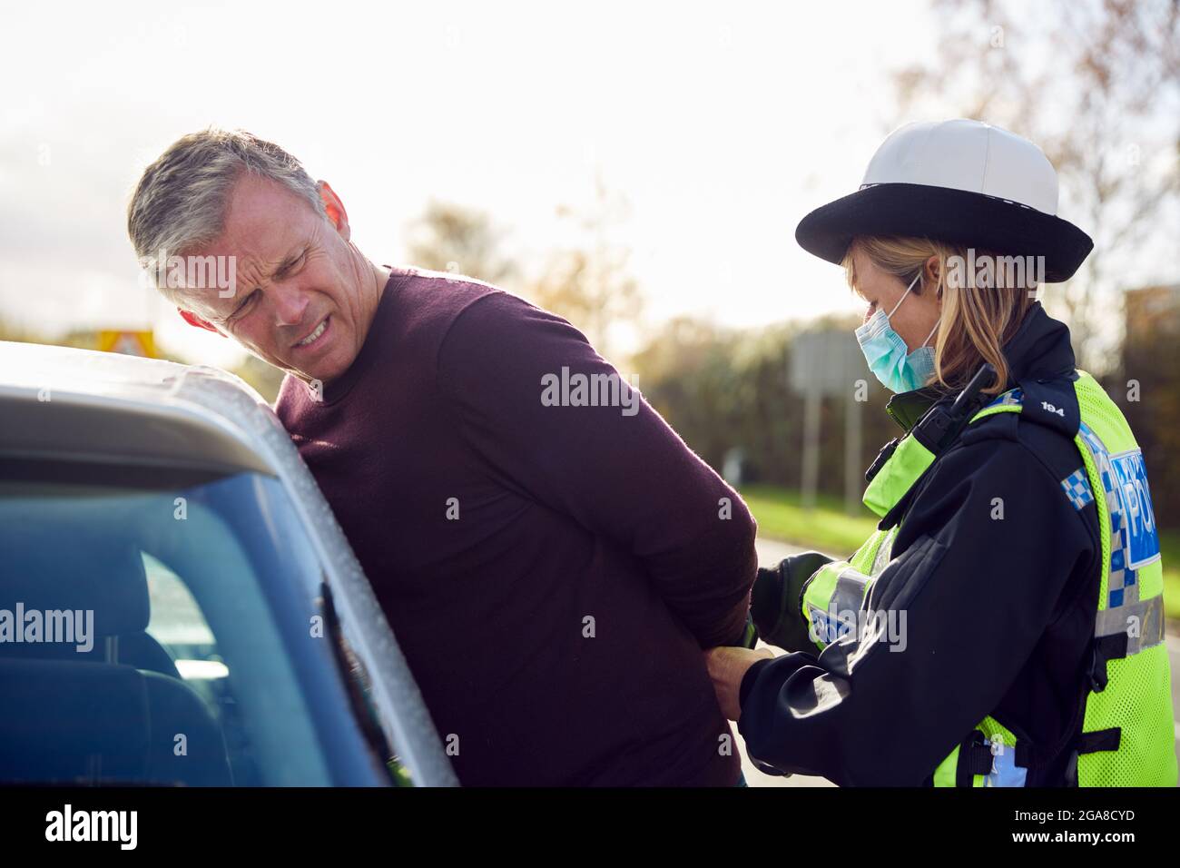 Arrested handcuffs woman hi-res stock photography and images - Alamy
