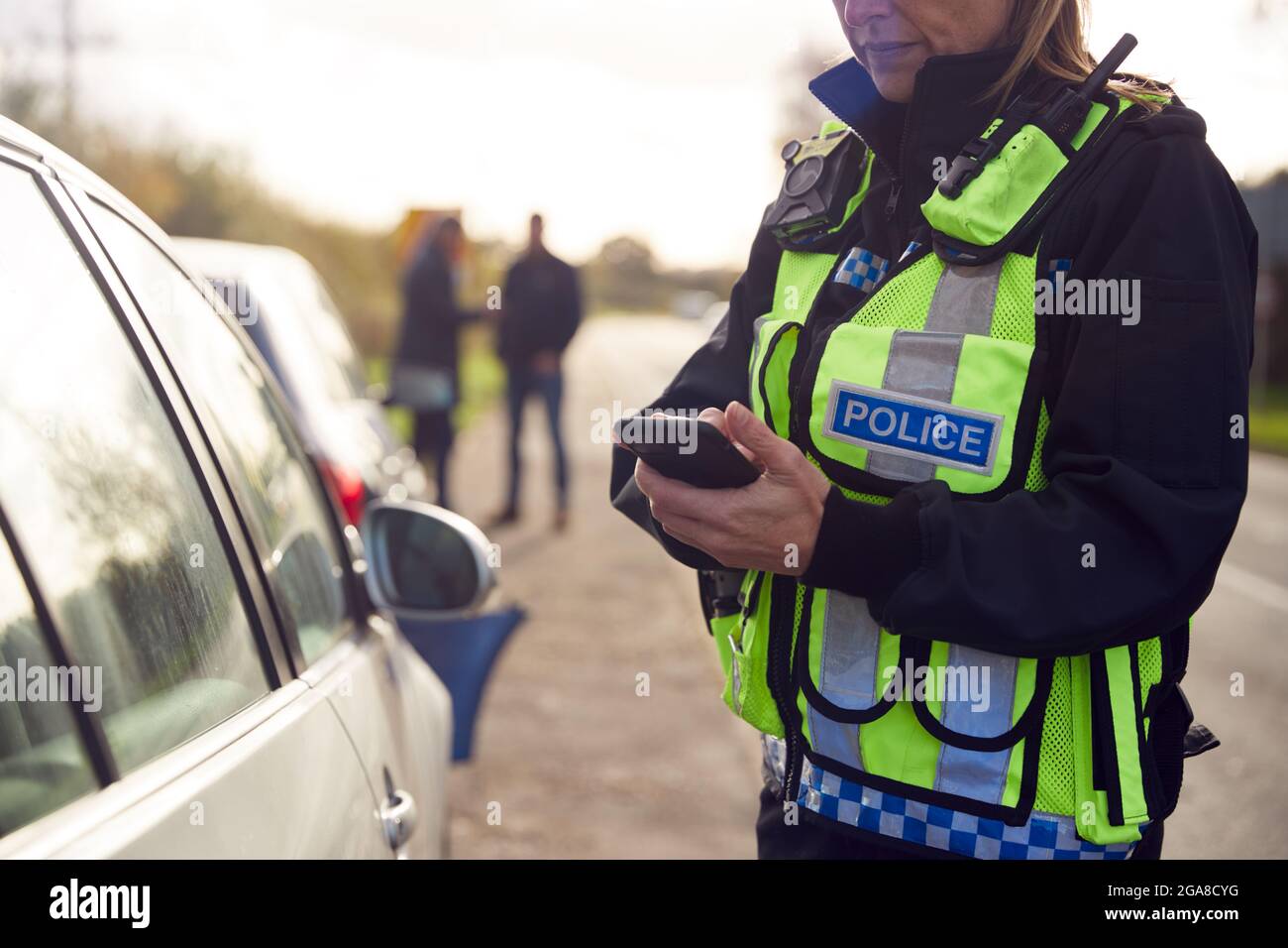 Female Traffic Police Officer Recording Details Of Road Traffic ...