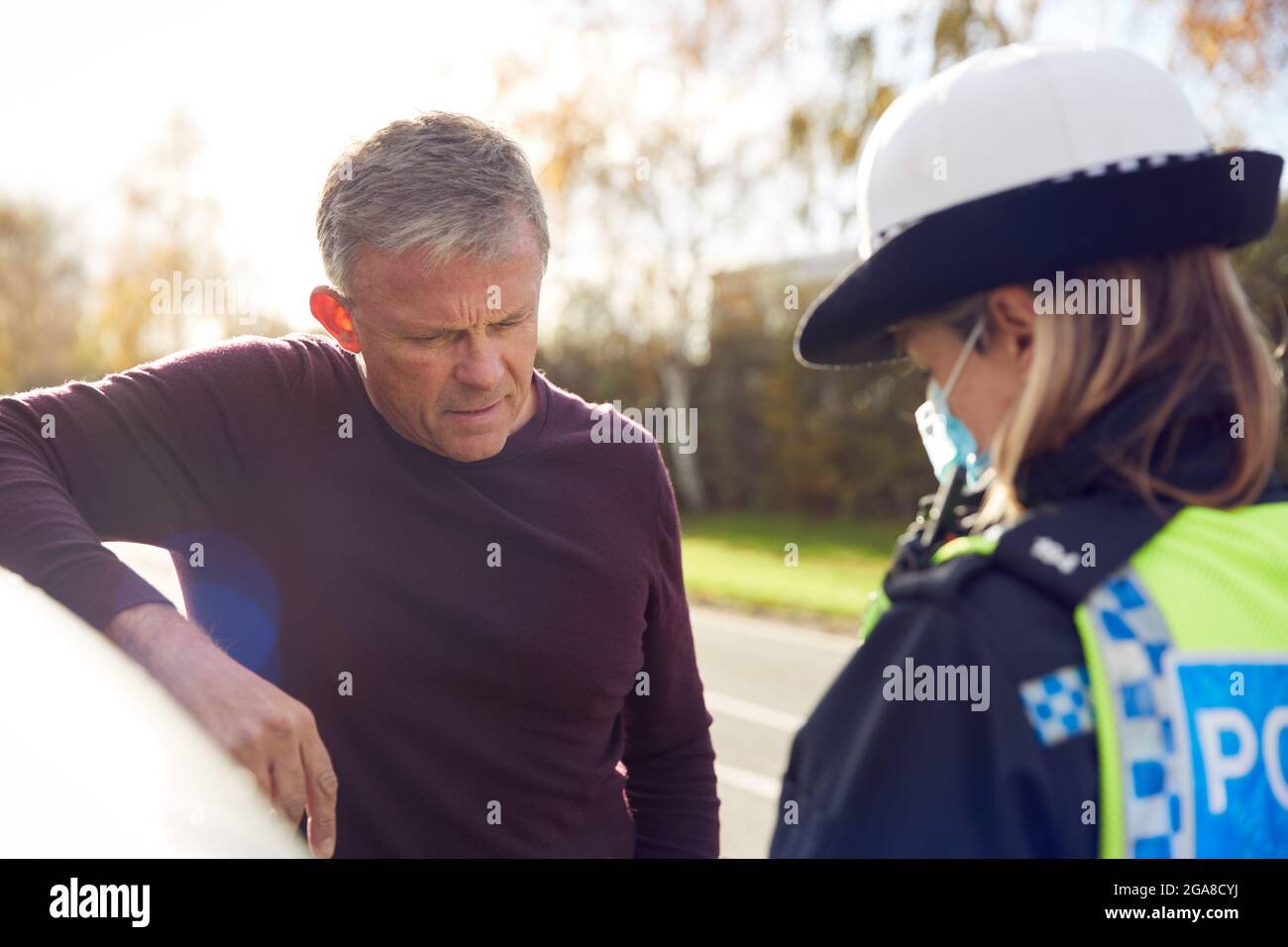 Male Driver Being Stopped By Female Traffic Police Officer For Driving ...