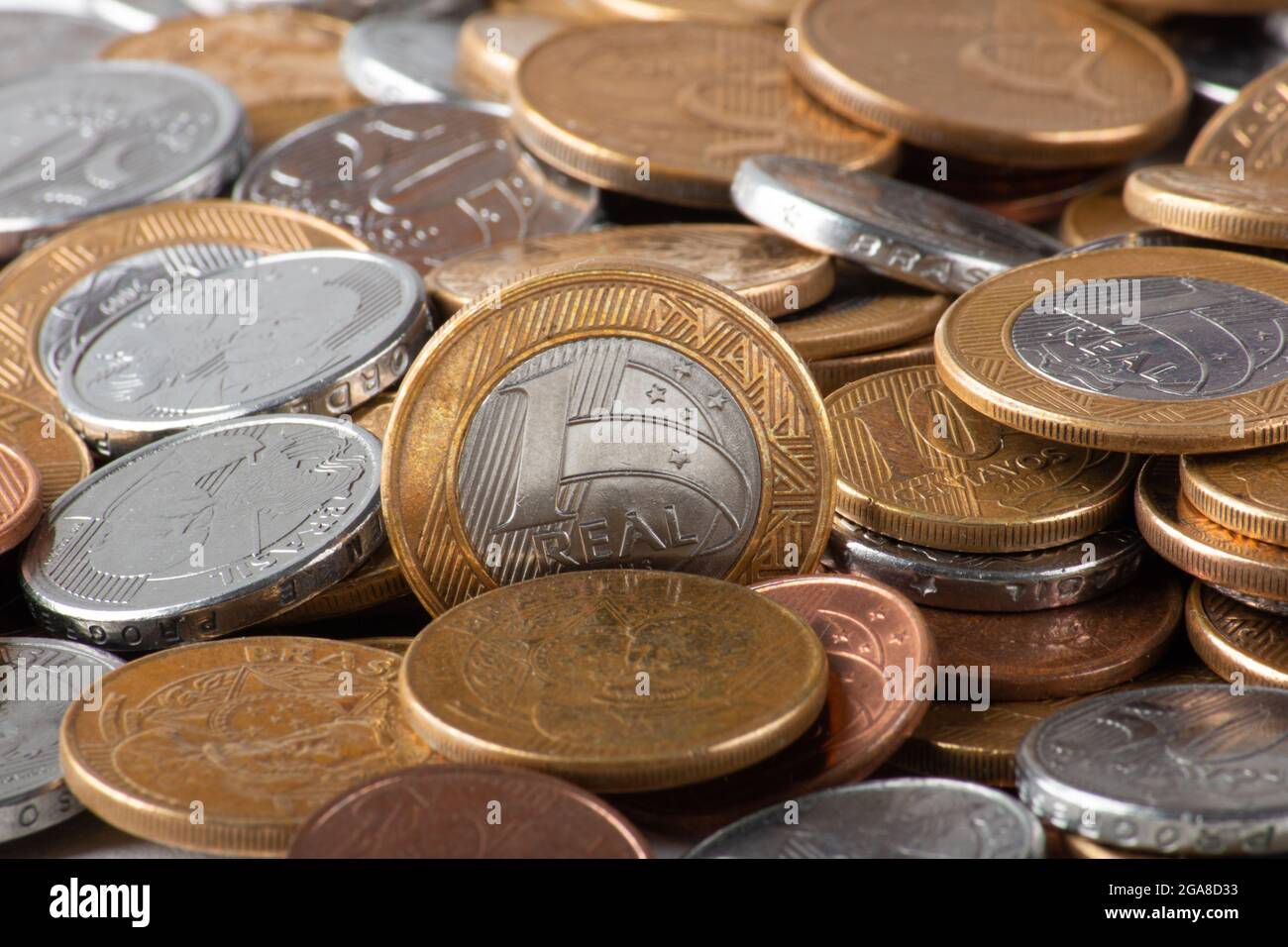 Real currency, money from Brazil. Stack with several Brazilian coins ...