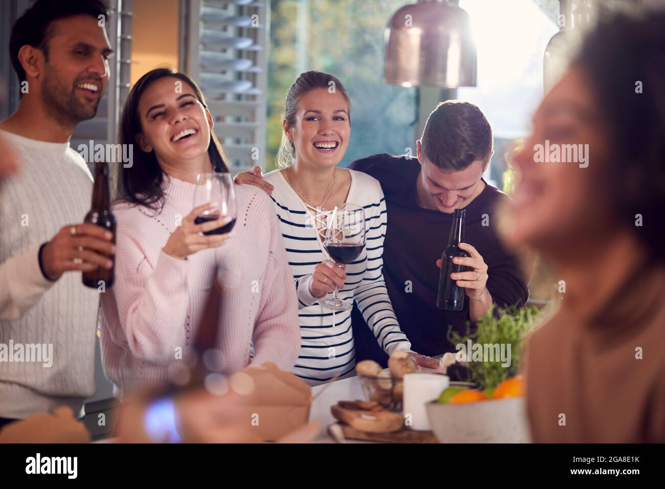 Group Of Multi Cultural Friends Enjoying Drinks Party At Home Together ...