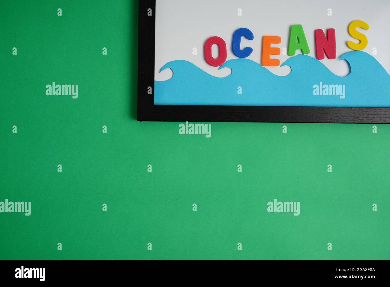 Letters OCEANS on a whiteboard with a copyspace with a summer vibe on a ...