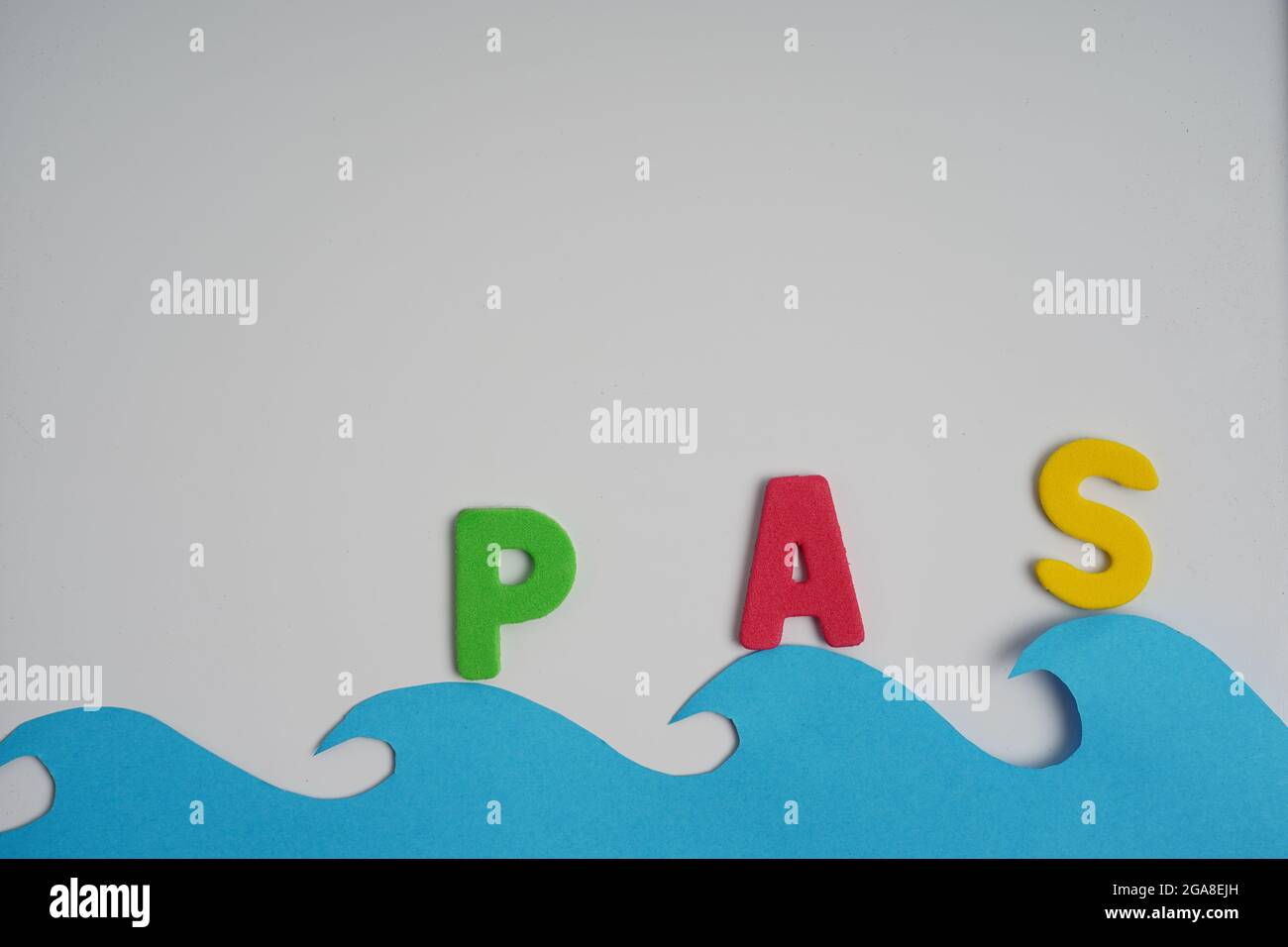Word PAS with colorful letters on a white background with sea waves ...