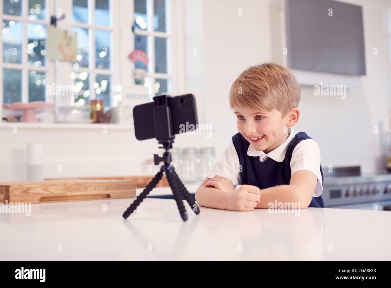 Boy At Home Wearing School Uniform Making Video Call On Mobile Phone ...