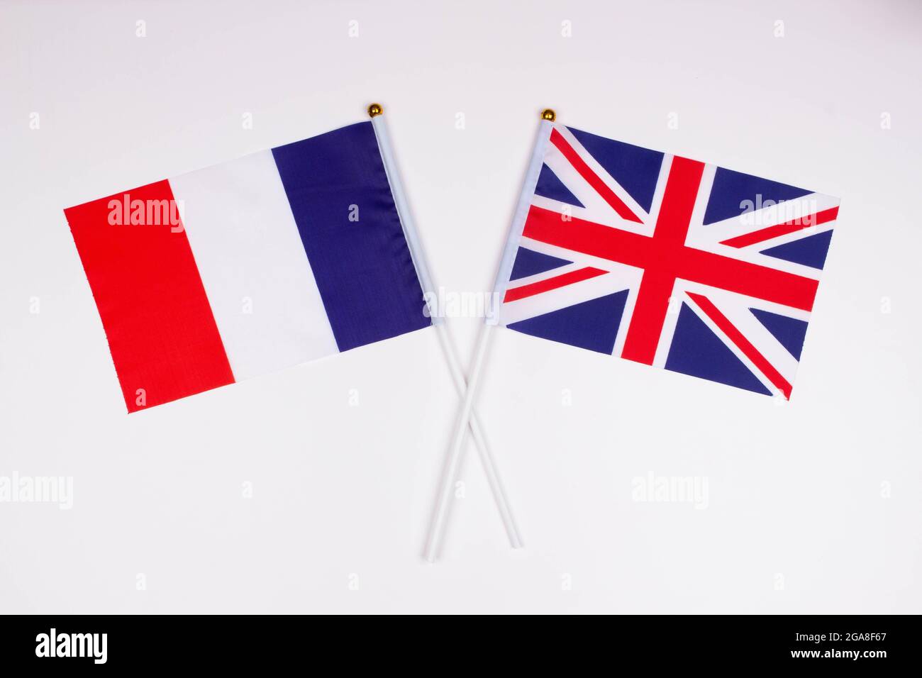 Flag of France and flag of Great Britain crossed with each other on a ...