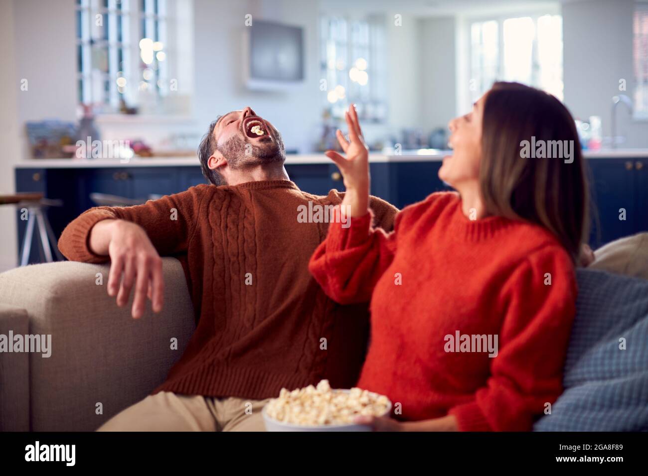 Catching popcorn in mouth hi-res stock photography and images - Alamy