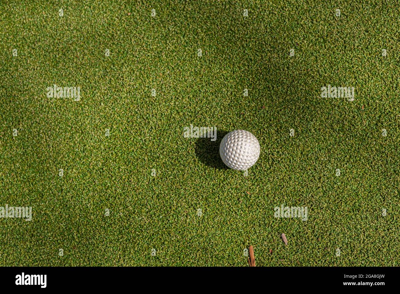 Golf ball on a minigolf course Stock Photo - Alamy