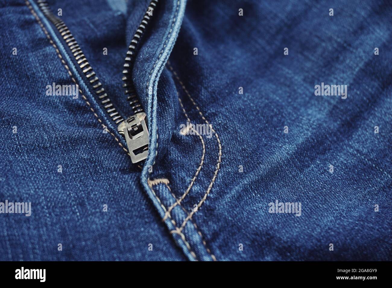 Blue jeans zipper texture Stock Photo - Alamy