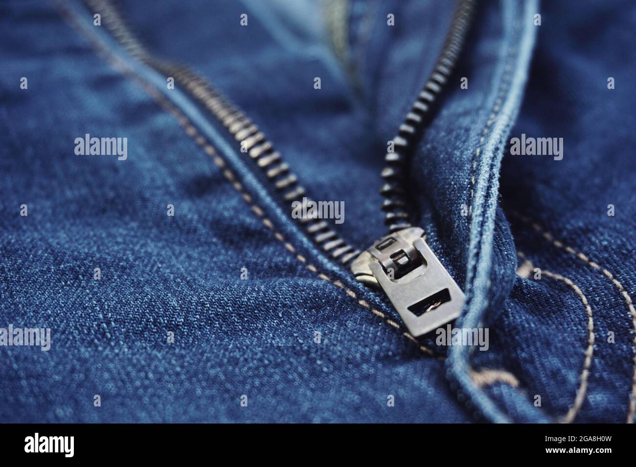 Blue jeans zipper texture Stock Photo - Alamy