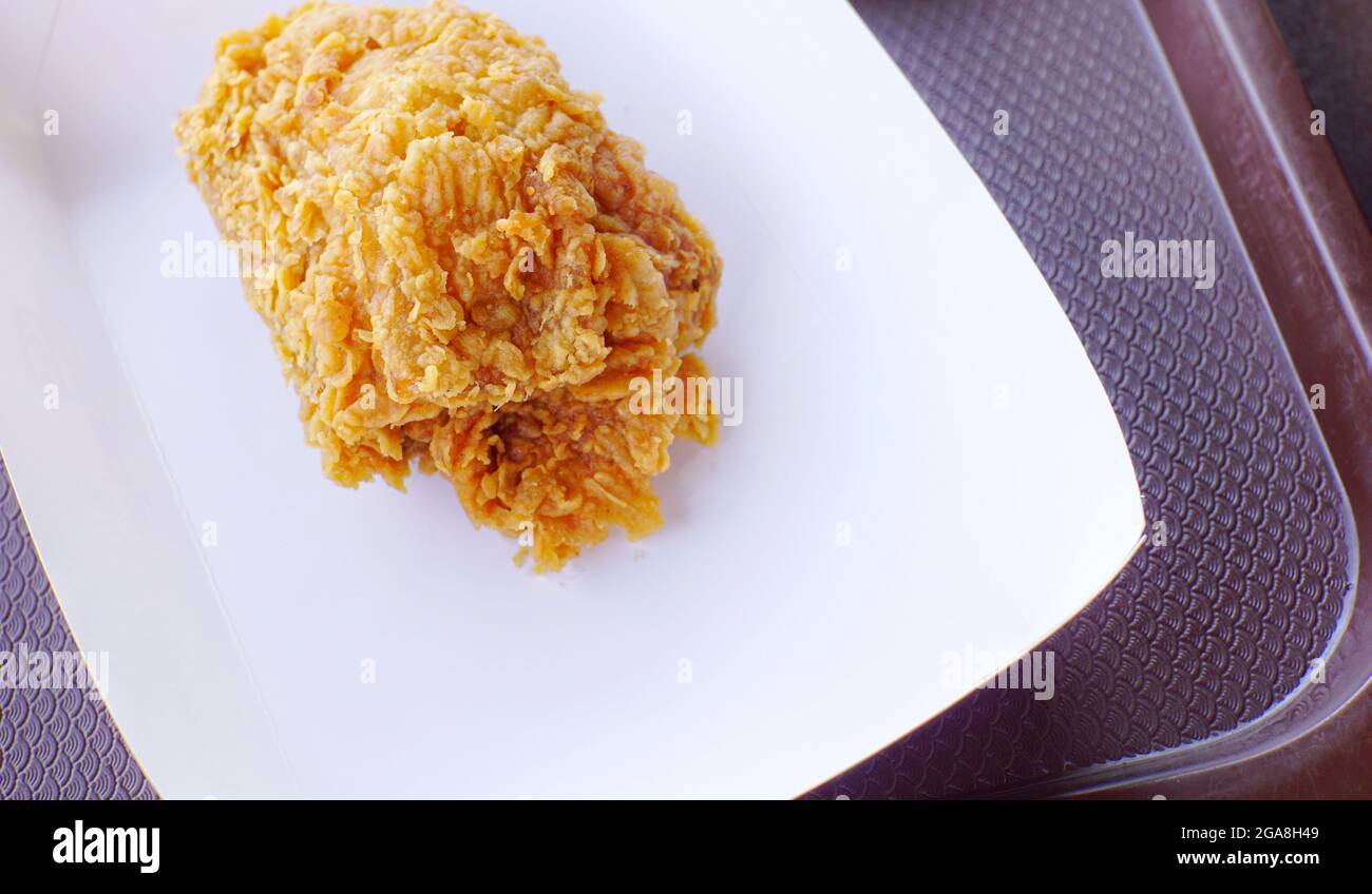 Delicious crispy chicken with crumbs on a paper plate Stock Photo - Alamy