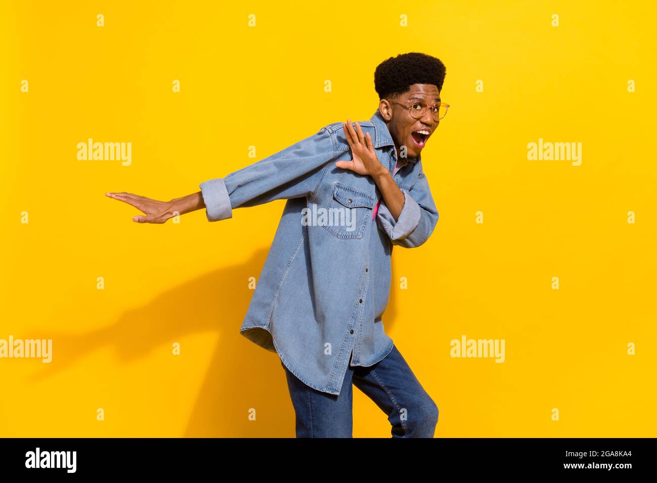 Photo of funky young afro american happy man dance good mood smile ...